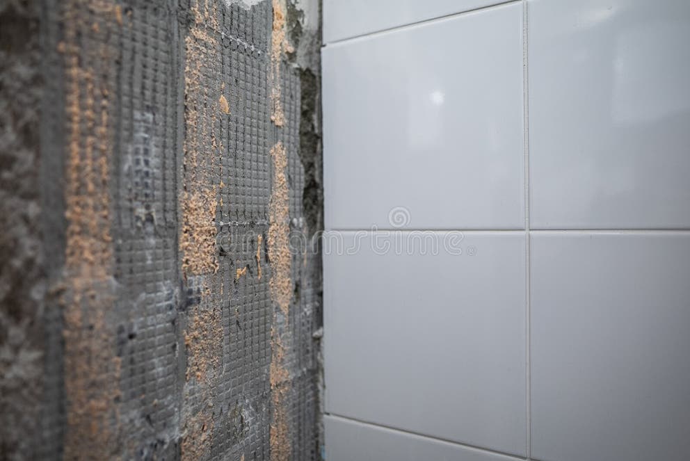 Partial tiling on one wall stock image. Image of concrete - 369117271