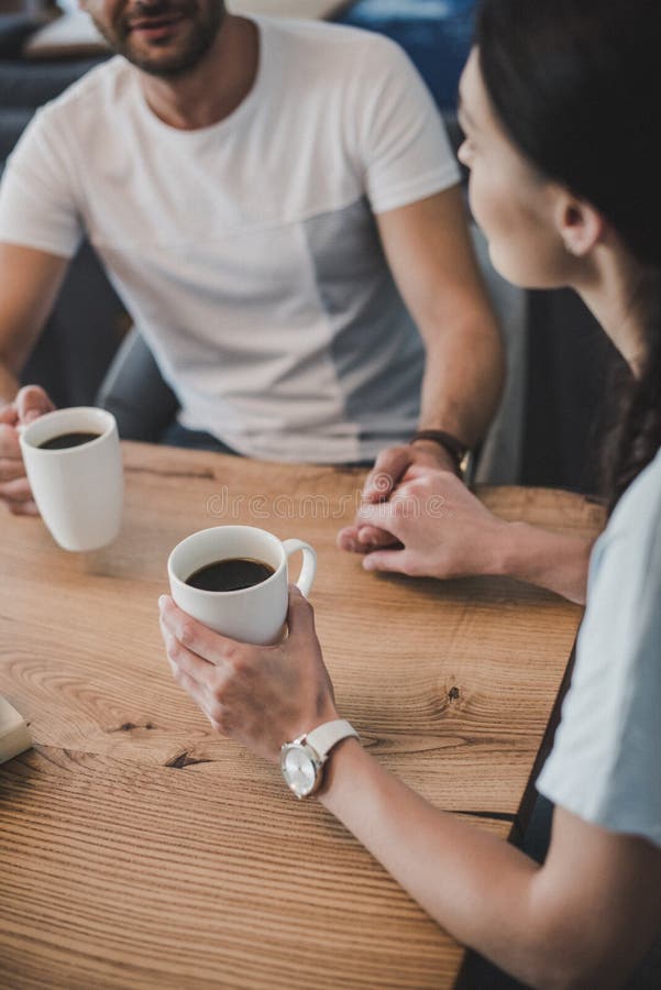 Partial View of Couple Drinking Coffee and Holding Hands Stock Image ...