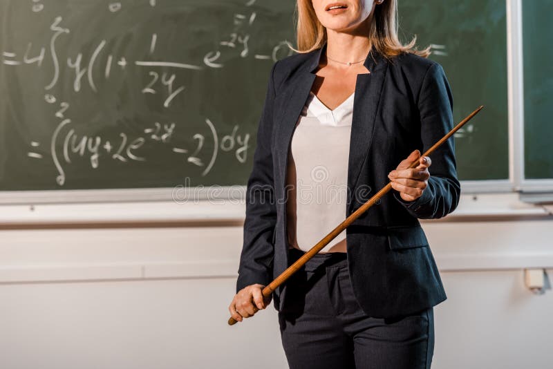 Partial View of Female Teacher in Formal Wear with Wooden Pointer ...