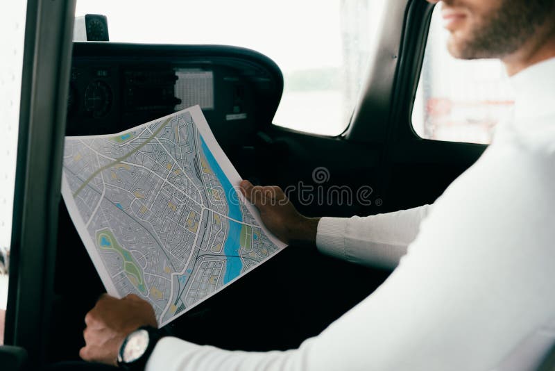 Partial View of Pilot Holding Map Stock Image - Image of adult, cropped ...