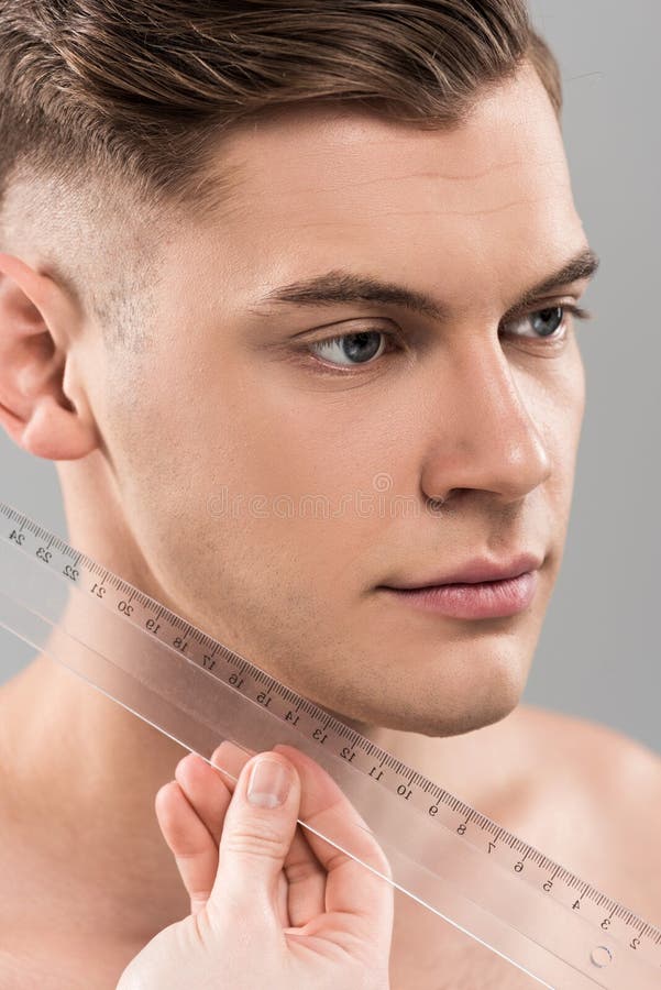 View of Plastic Surgeon Measuring Face with Ruler Isolated on Grey ...