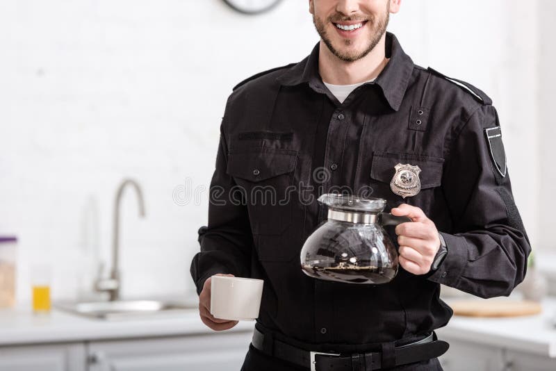 Partial View of Smiling Policeman Holding Glass Pot of Filtered Coffee ...