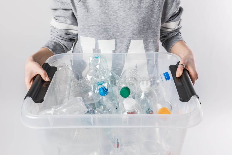 Partial View of Woman Holding Container with Plastic Bottles Isolated ... Partial View of Woman Holding Container with Plastic Bottles Isolated ...