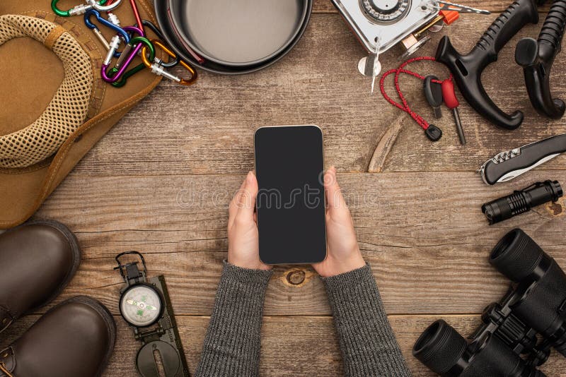 Partial View of Woman Holding Smartphone with Blank Screen Over Hiking ... Partial View of Woman Holding Smartphone with Blank Screen Over Hiking ...