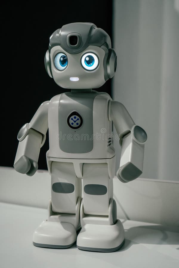 Partially Blurred Humanoid White Robot, with Glowing Blue Eyes ...