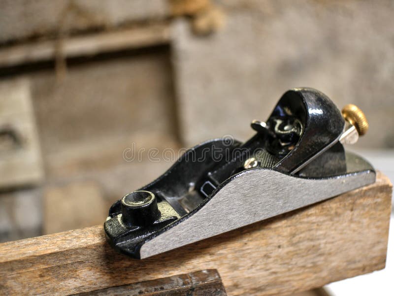 Small Plane, Placed on a Board, in a Carpentry Workshop Stock Photo ...