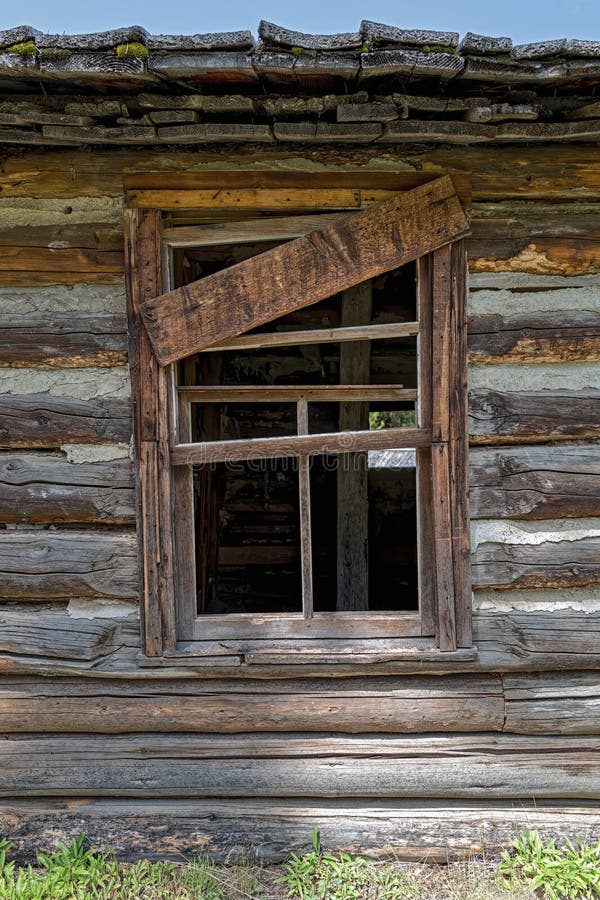 A Partially Boarded Window Frame in an Abandoned Log Cabin Stock Image ...