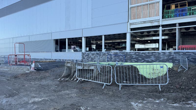 Partially Completed Building Exterior with Construction Materials ...