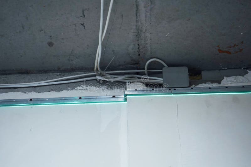 In a Partially Constructed Room, a Green Laser Beam Cuts Across the ...