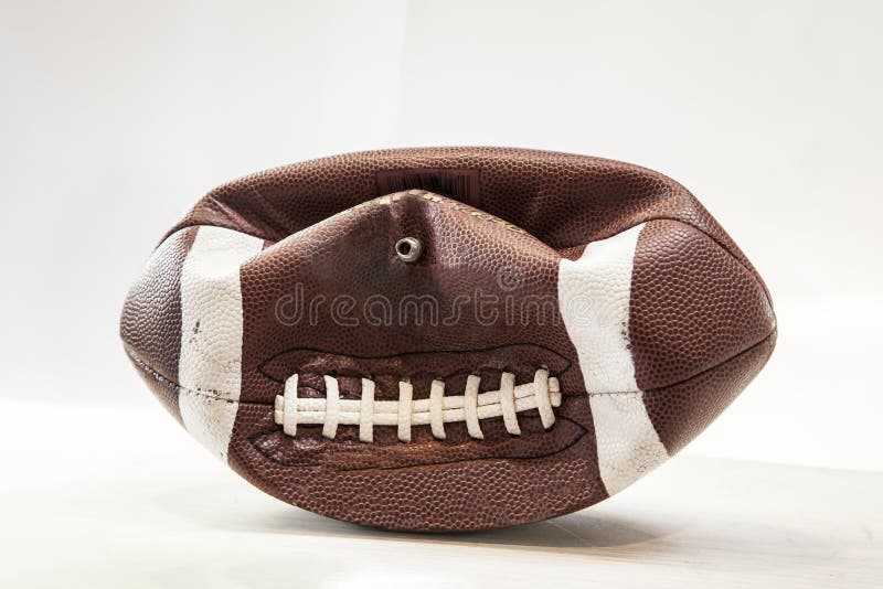Partially Delfated Football Stock Image - Image of deflategate, scandal ...