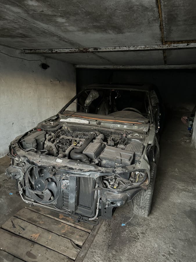 Partially Disassembled Car Inside an Abandoned Garage Stock Photo ...