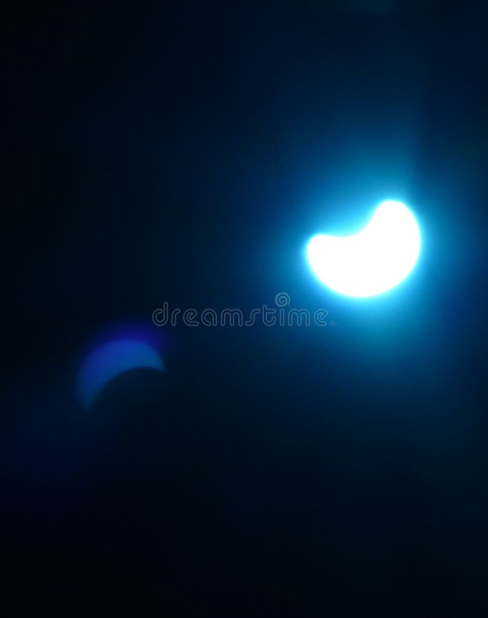 Partially Eclipsed Sun through a Dark Blue Filter Stock Photo - Image ...