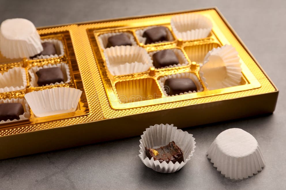 Partially Empty Box of Chocolate Candies on Grey Table Stock Photo ...