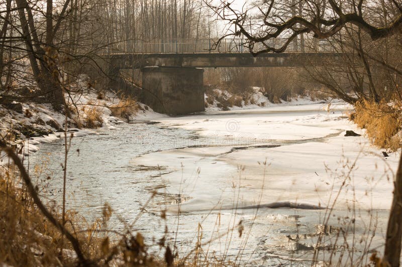 Partially Frozen River with a Bridge Stock Image - Image of winter ...