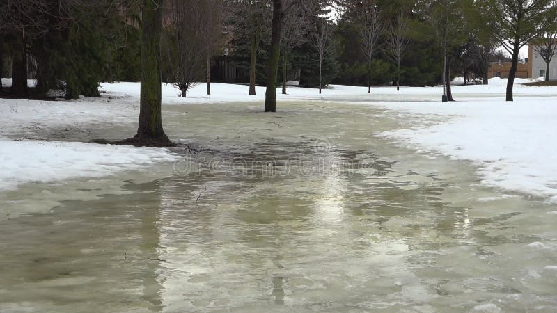 Partially Melted Ice and Snow Turning into Water and Flowing Downhill ...
