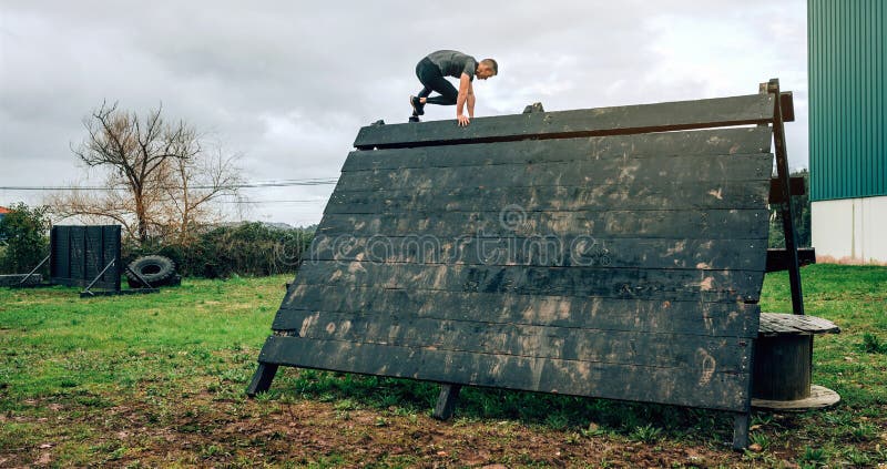Participant in Obstacle Course Climbing Pyramid Obstacle Stock Photo ...