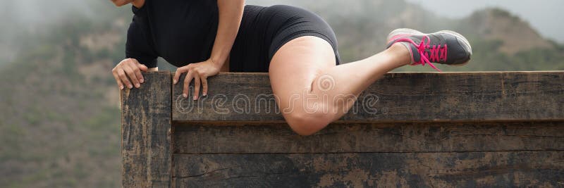 Participant in an Obstacle Course Running and Climbing a Wall Stock ...
