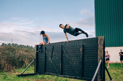 Participants in Obstacle Course Climbing Wall Stock Image - Image of ...