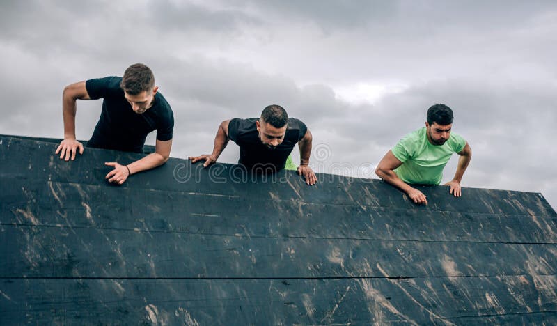 Participants in Obstacle Course Climbing Wall Stock Photo - Image of ...