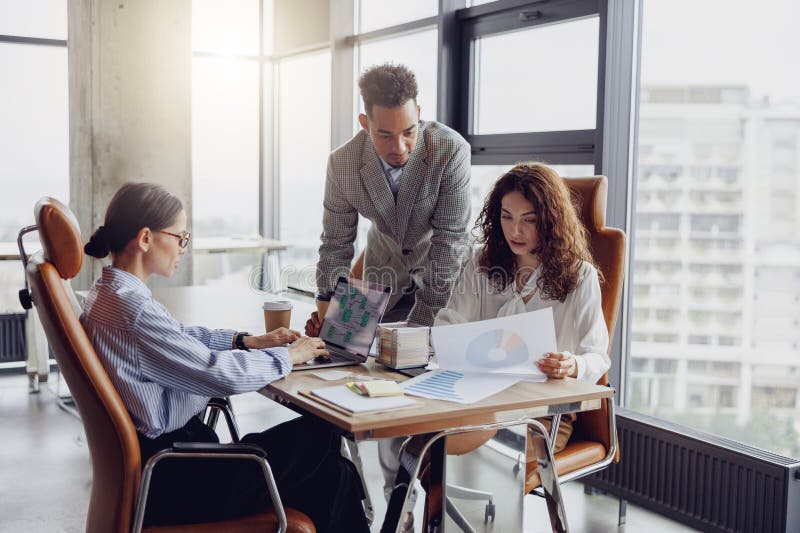 Participating in a Collaborative Business Meeting in a Modern Office is ...