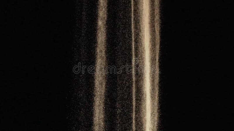 Particles of White Dry Sand are Pouring Down on Black Studio Background ...