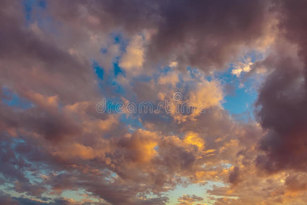 Partly Cloudy Sky at Sunset. Dramatic Clouds at Sunset Stock Photo ...