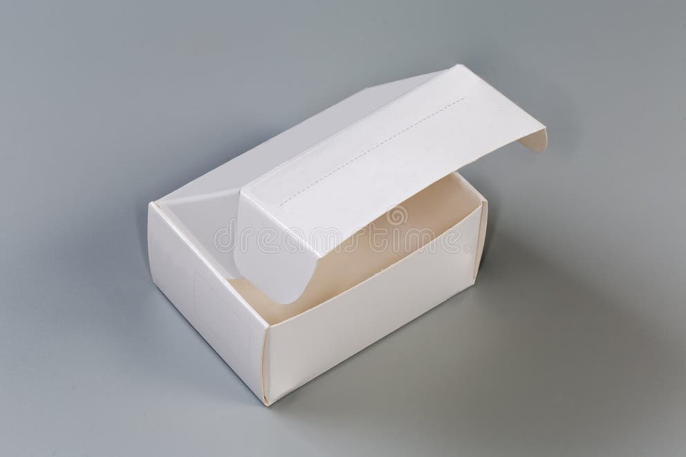 Partly Open Small White Cardboard Box on a Gray Surface Stock Photo ...