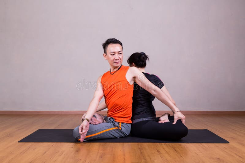 Partner Twist Yoga Pose by a Couple Stock Image - Image of asana, male ...