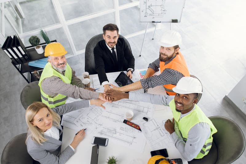 Partners Gathering at Office for Creating Plan of Building Stock Photo ...