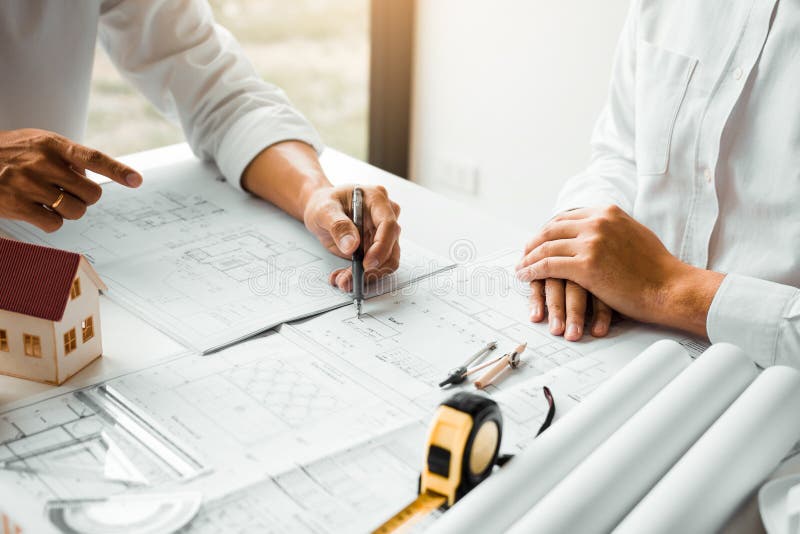 The Partnership Engineering Man or Co-workers Working on a Project and ...