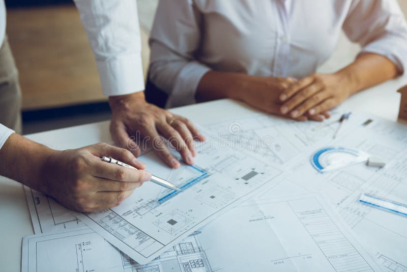 The Partnership Engineering Man or Co-workers Working on a Project and ...