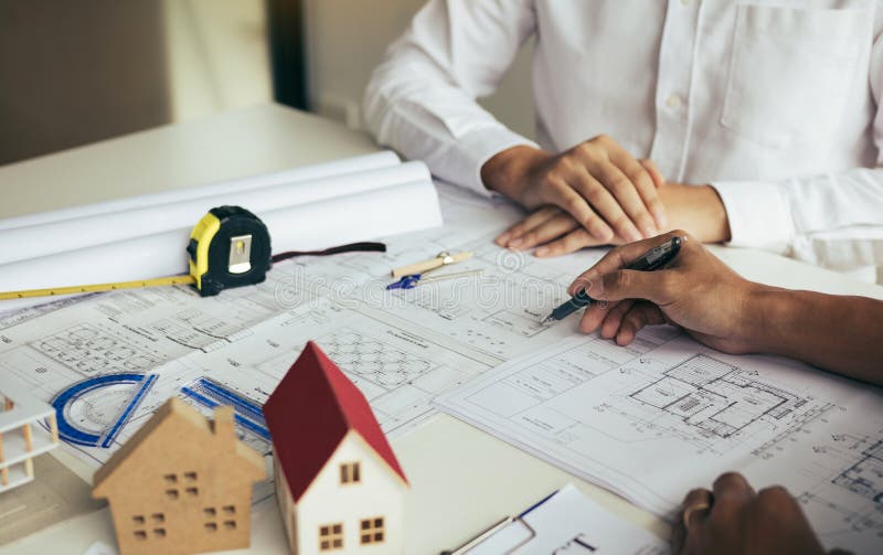 The Partnership Engineering Man or Co-workers Working on a Project and ...