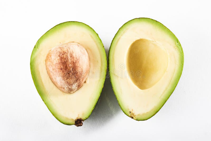 Two Parts of Avocado and Nut Stock Image - Image of peel, halved: 17438929