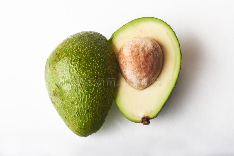 Two Parts of Avocado and Nut Stock Image - Image of peel, halved: 17438929