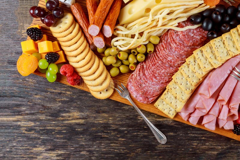 Party Appetizer Plate Consisting of Cheese, Crackers, Nuts, and Other ...