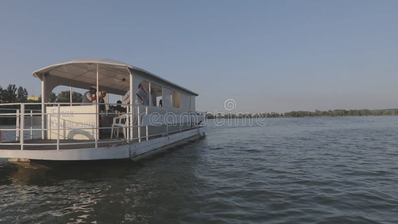 Party Boat Floats on the River at Sunset. Party Boat at Sunset ...