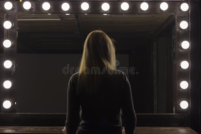 Party Girl Standing in Front of a Mirror, Stock Photo - Image of ...