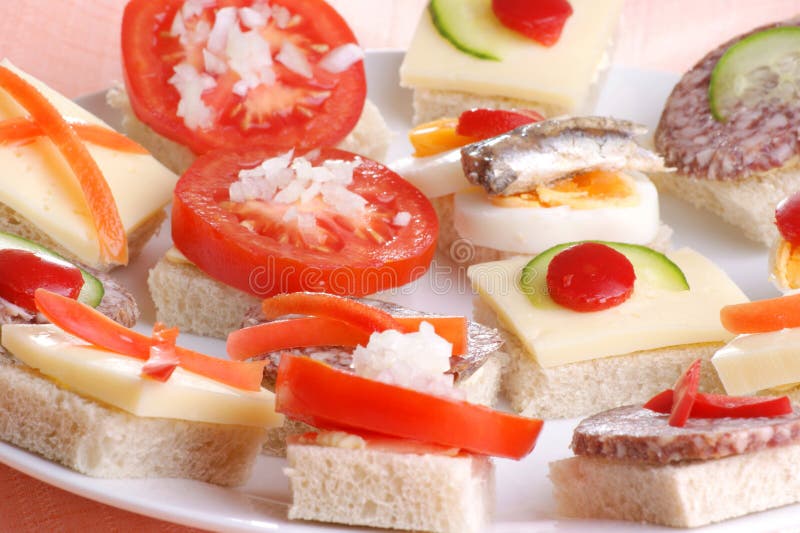 Party Nibbles on a White Plate Stock Photo - Image of tomato, salami ...