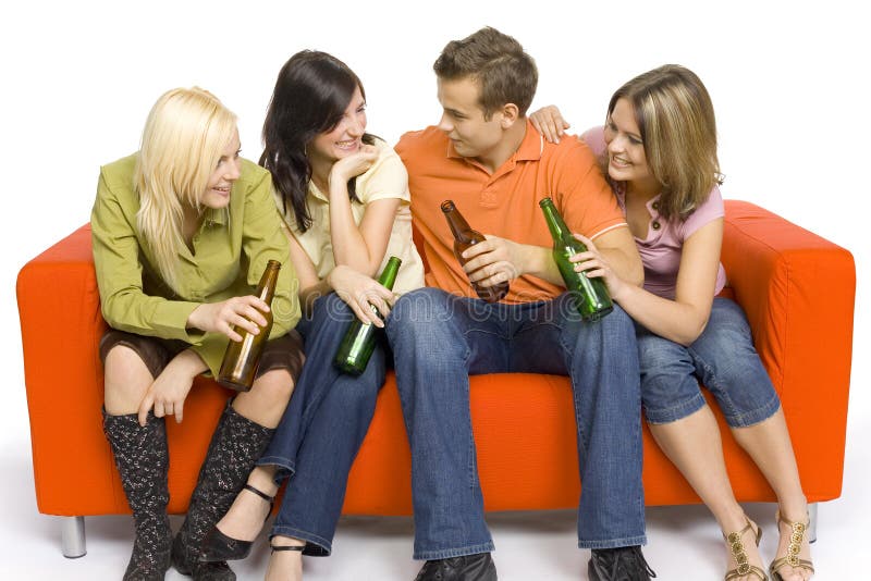 Party on the orange couch stock image. Image of culture - 2157791