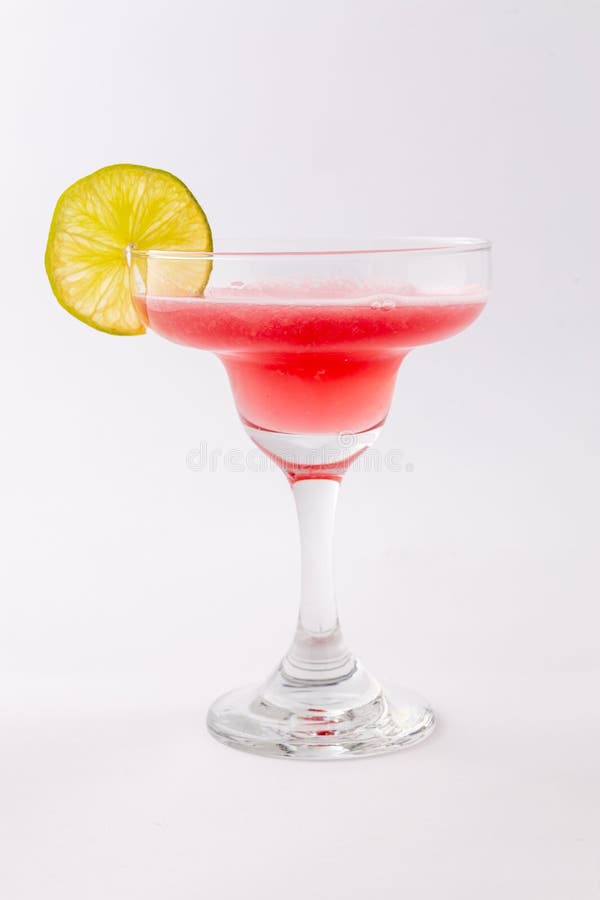 Party Red Cocktail Decorated with Lime Slice in a Glass Stock Photo ...