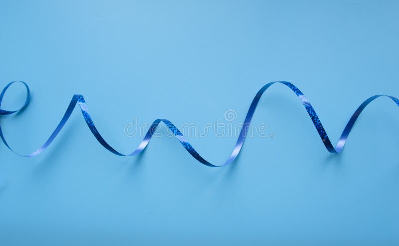 Party Ribbon Confetti on Blue Stock Photo - Image of curly, christmas ...
