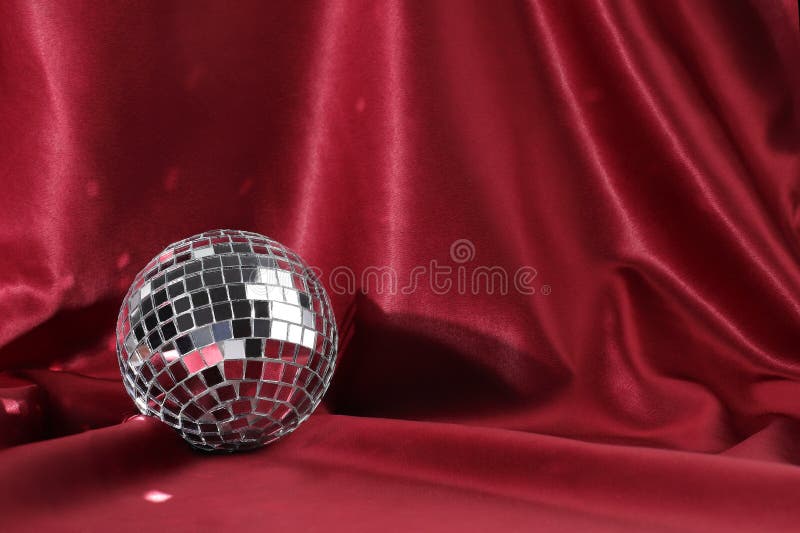 Shiny Mirror Ball on Red Silk Background, Party Concept Stock Photo ...