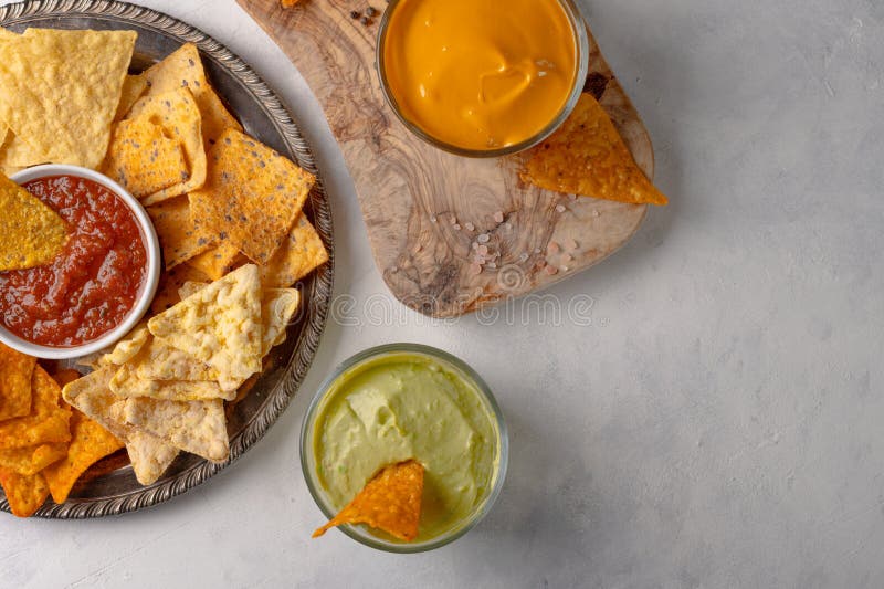 Party Snacks, Various Types of Chips with Dip and Salsa, Top View Stock ...