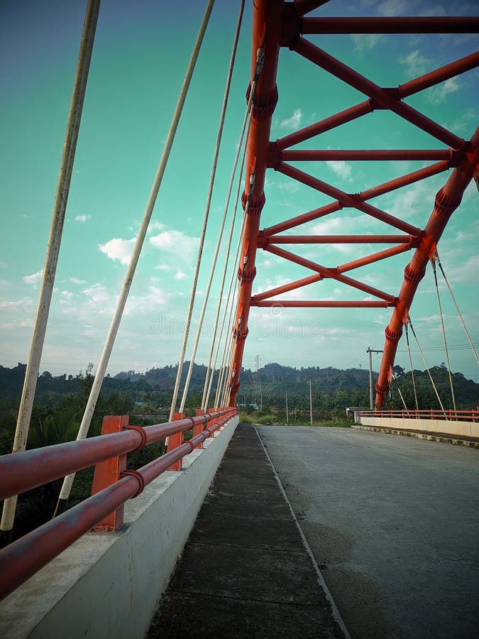 Pasangkayu red bridge stock photo. Image of walkway - 291638024