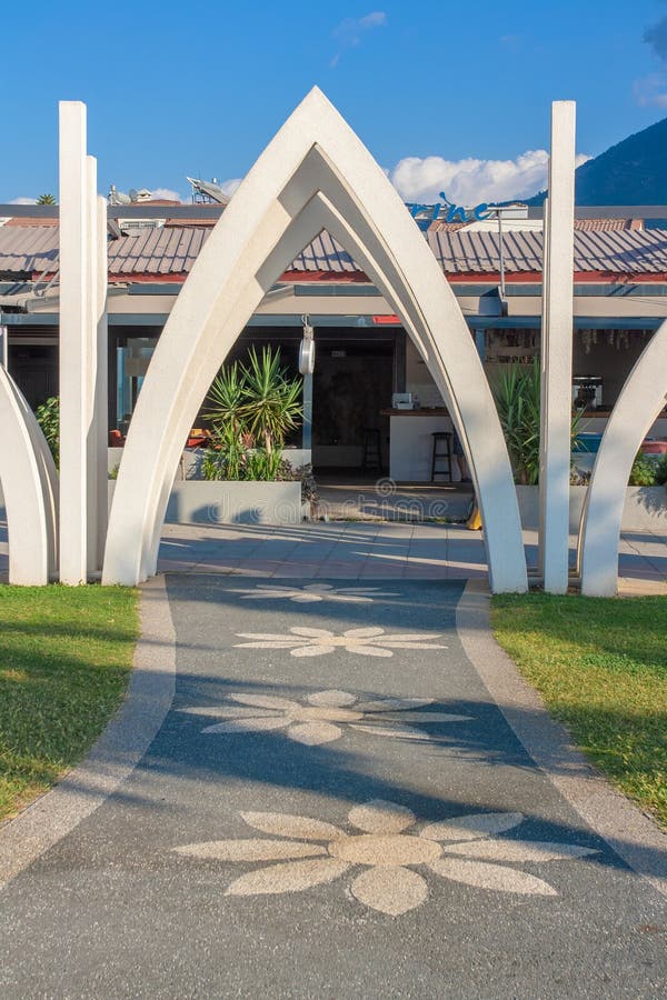 Passage through Arched Gate Along the Road with Flowers Stock Photo ...