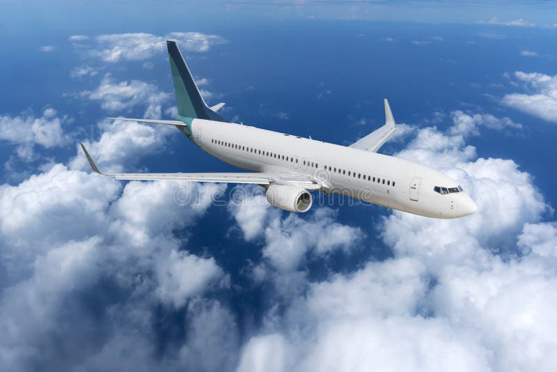 Passenger Airliner Airplane Flying Over the White Clouds Stock Image ...