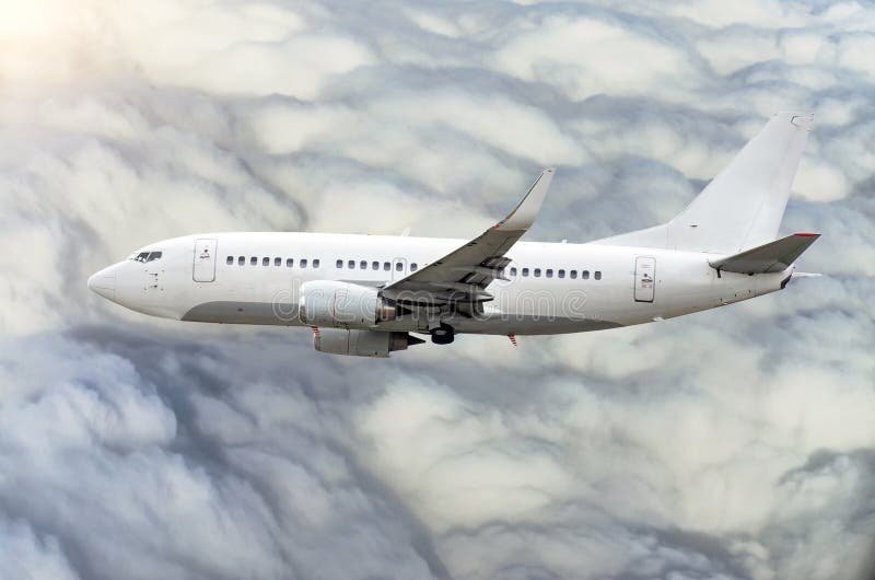 Passenger Airplane Flies in the Sky Gaining Height Above the Clouds ...