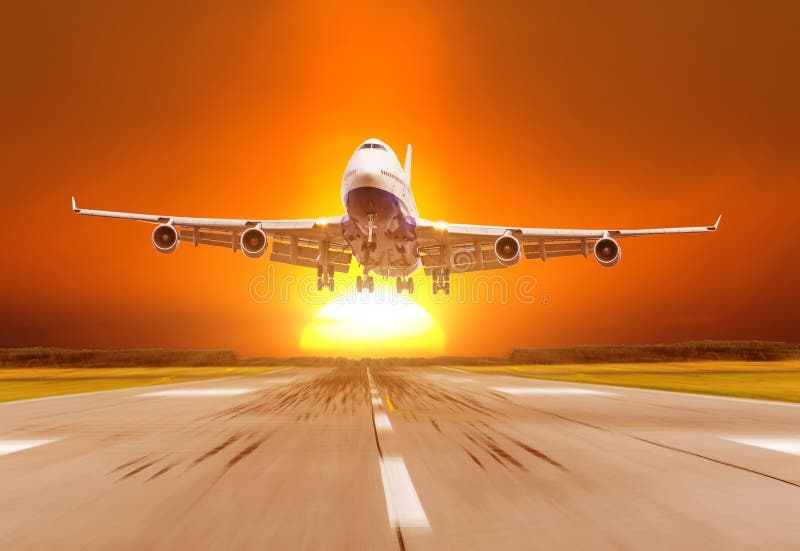 Passenger Airplane Landing at Sunset on a Runway. Stock Image - Image ...