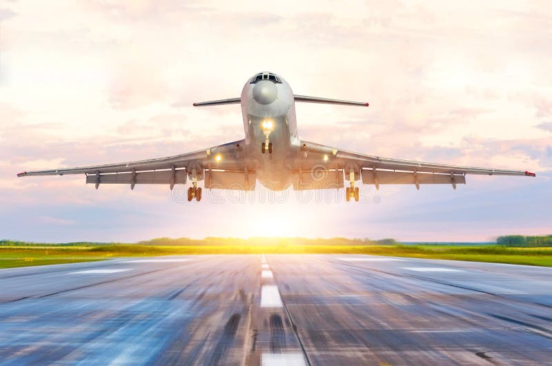 Passenger Airplane Landing at Sunset on a Runway. Stock Photo - Image ... Passenger Airplane Landing at Sunset on a Runway. Stock Photo - Image ...