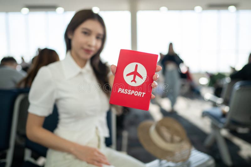A Passenger at the Airport Boarding Gate with Her Passport in Hand ...